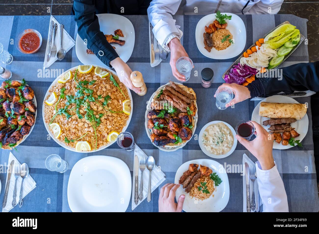 happy Muslim family eating together Stock Photo - Alamy
