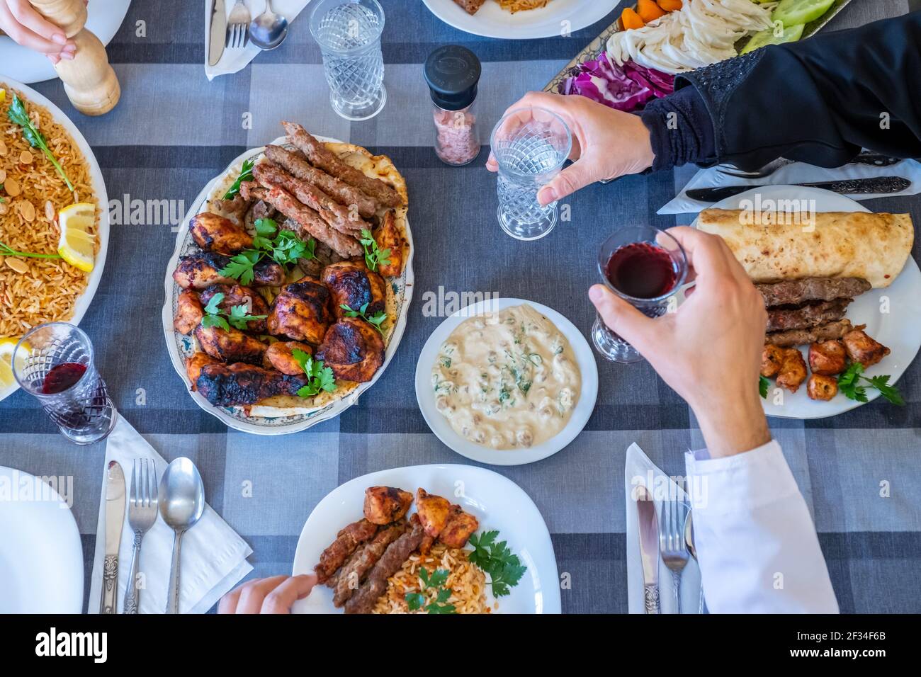happy Muslim family eating together Stock Photo - Alamy