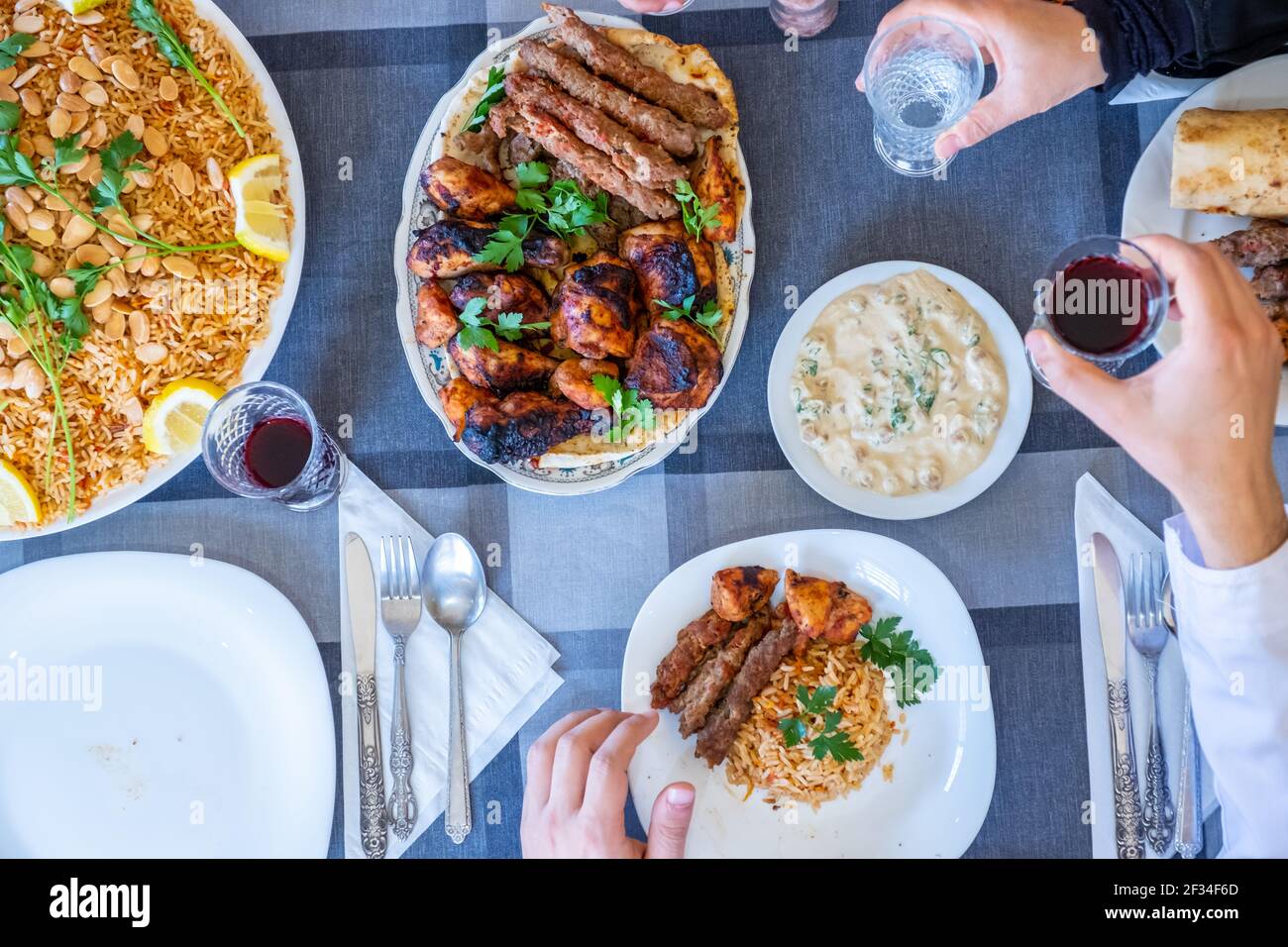happy Muslim family eating together Stock Photo - Alamy