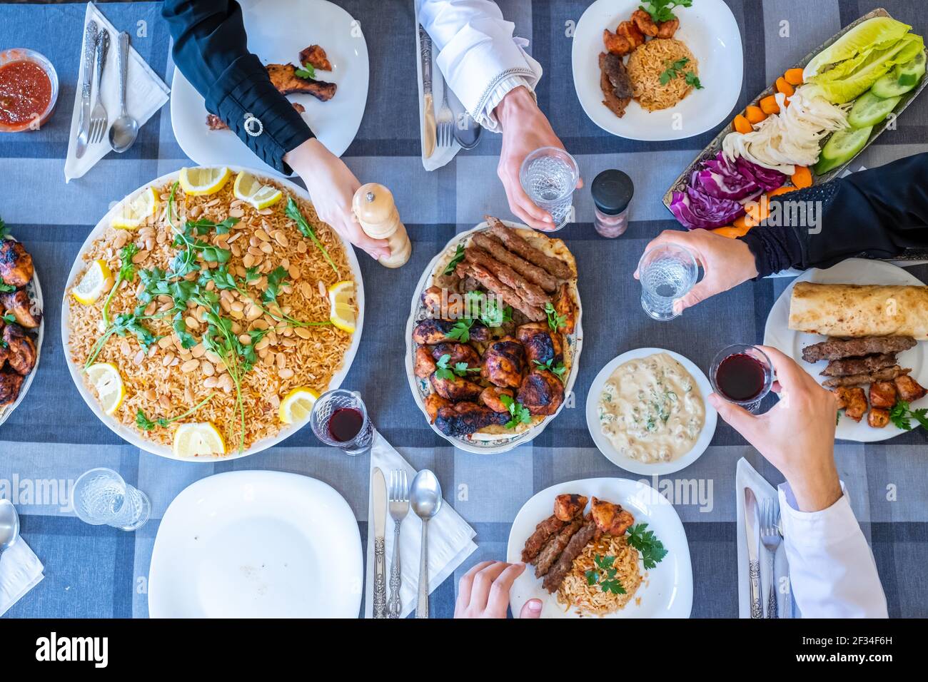 happy Muslim family eating together Stock Photo - Alamy