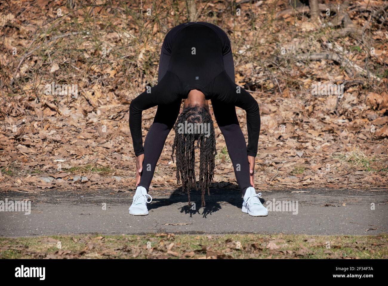 A nimble flexible woman in her fifties leads a daily meditative yoga ...