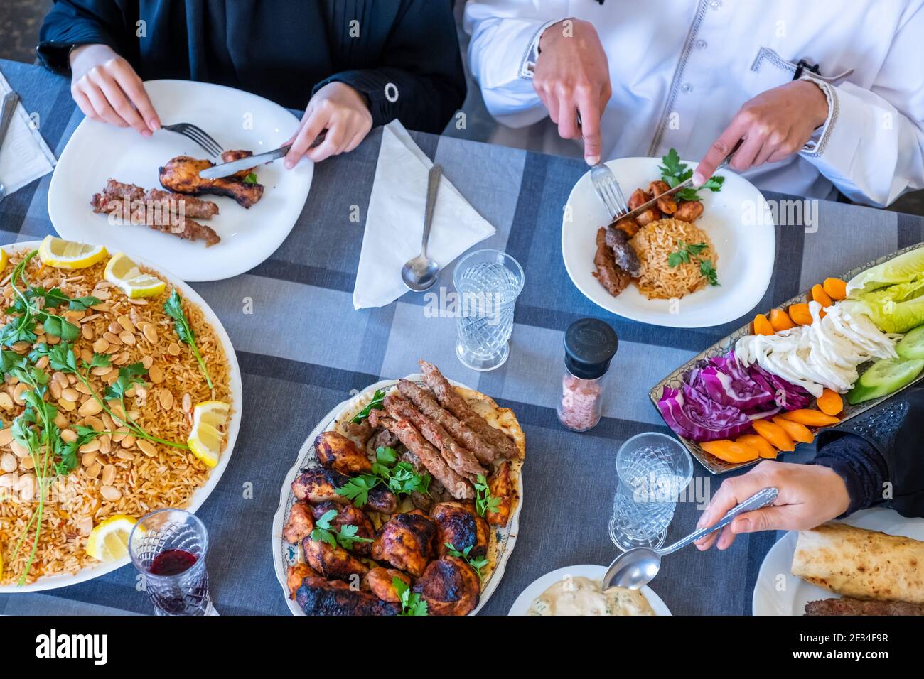 happy Muslim family eating together Stock Photo - Alamy