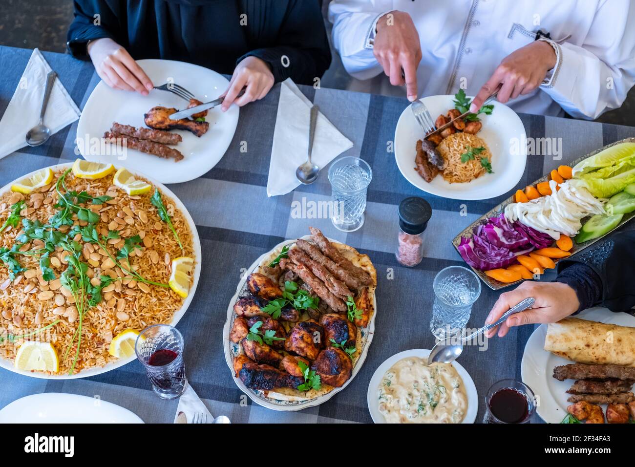 happy Muslim family eating together Stock Photo - Alamy