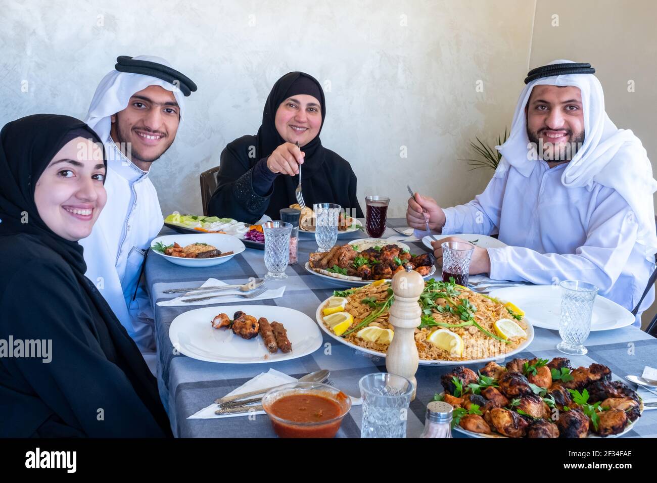 Happy arabic muslim family enjoying the food togther in ramadan Stock ...