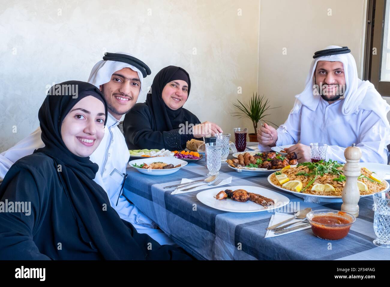Happy arabic muslim family enjoying the food togther in ramadan Stock ...
