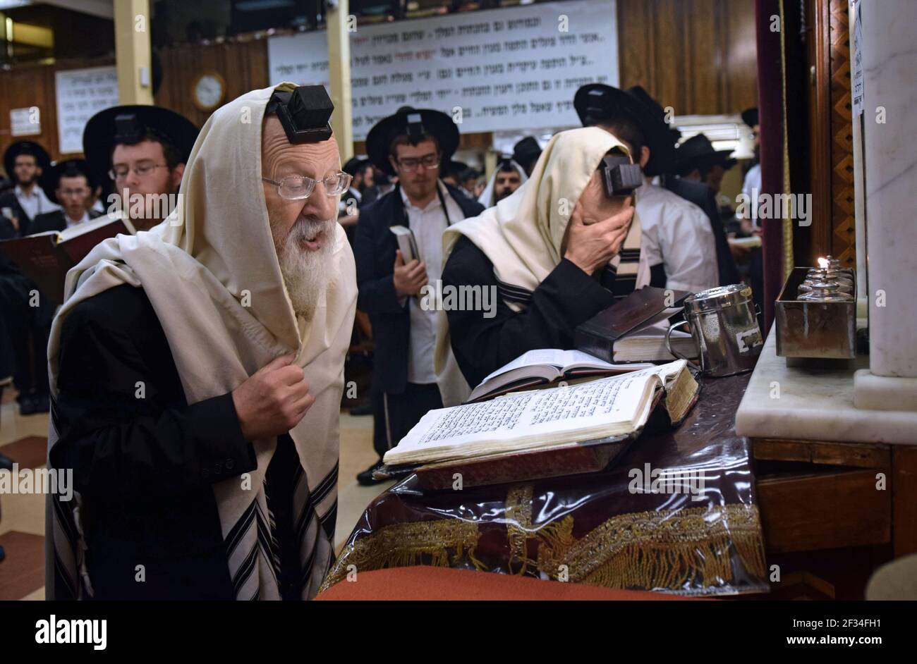 Jewish men of various ages attend morning services at the main ...