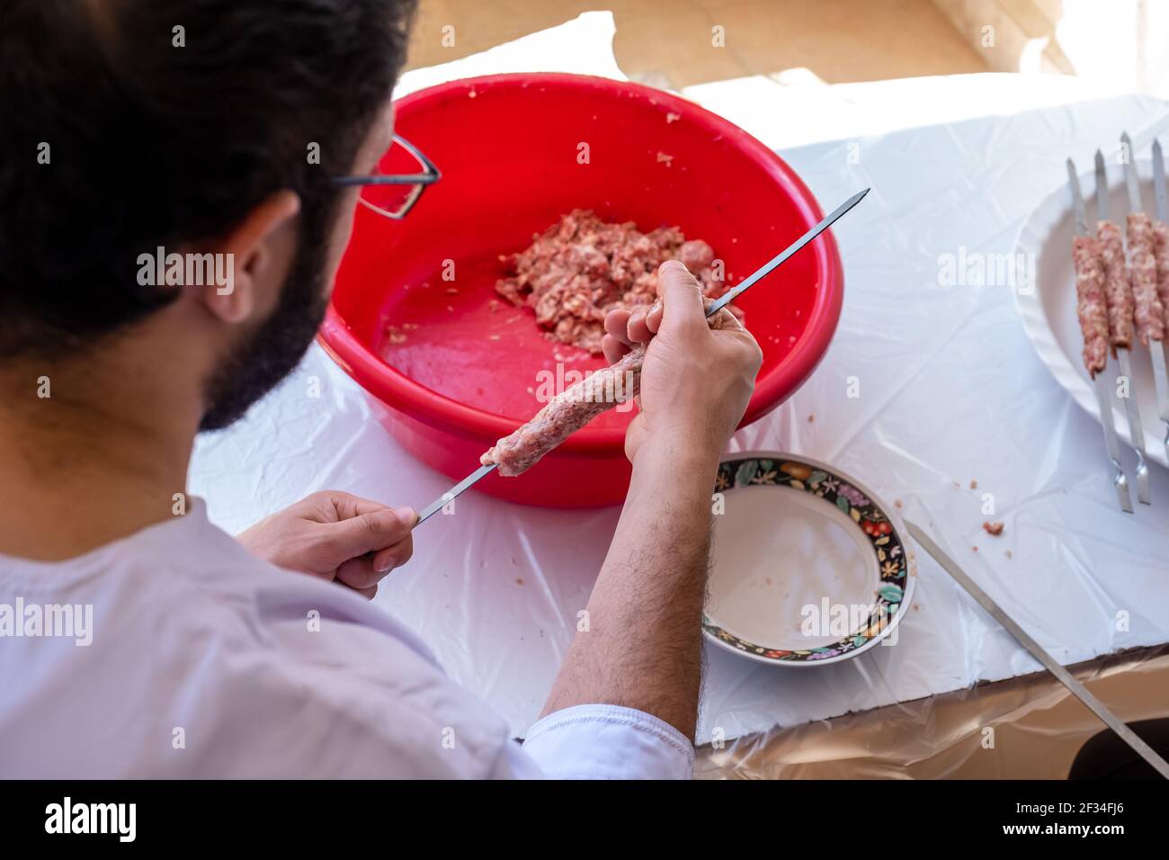 Arabic Muslim family preparing for barbeque Stock Photo - Alamy