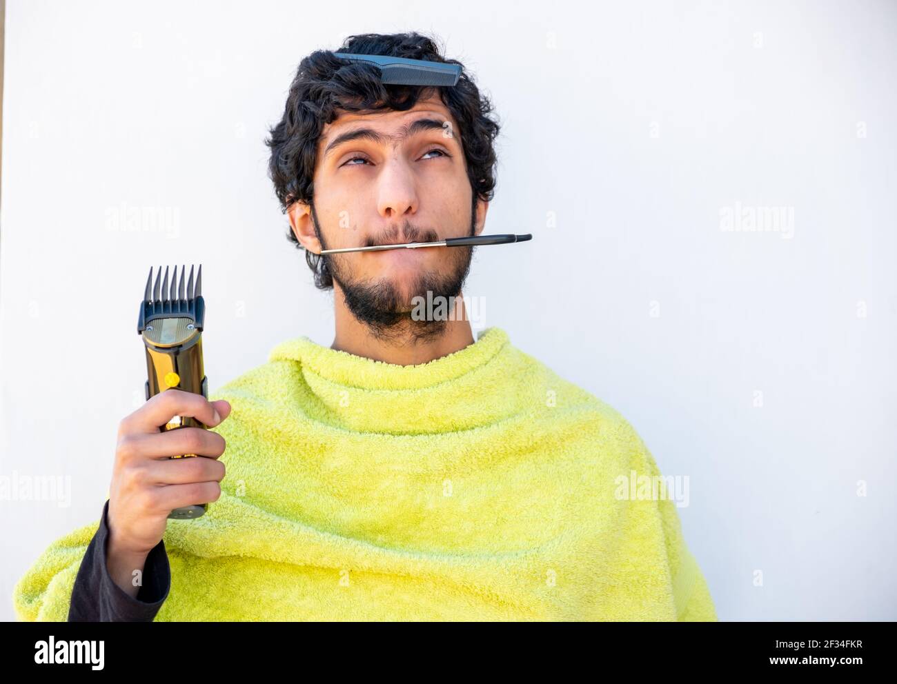Arabic muslim man feeling upset while holding barber tools Stock Photo ...