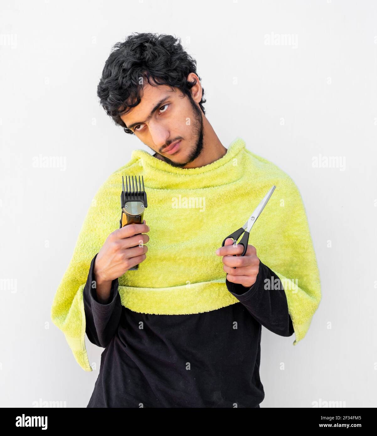 Arabic muslim man feeling upset while holding barber tools Stock Photo ...