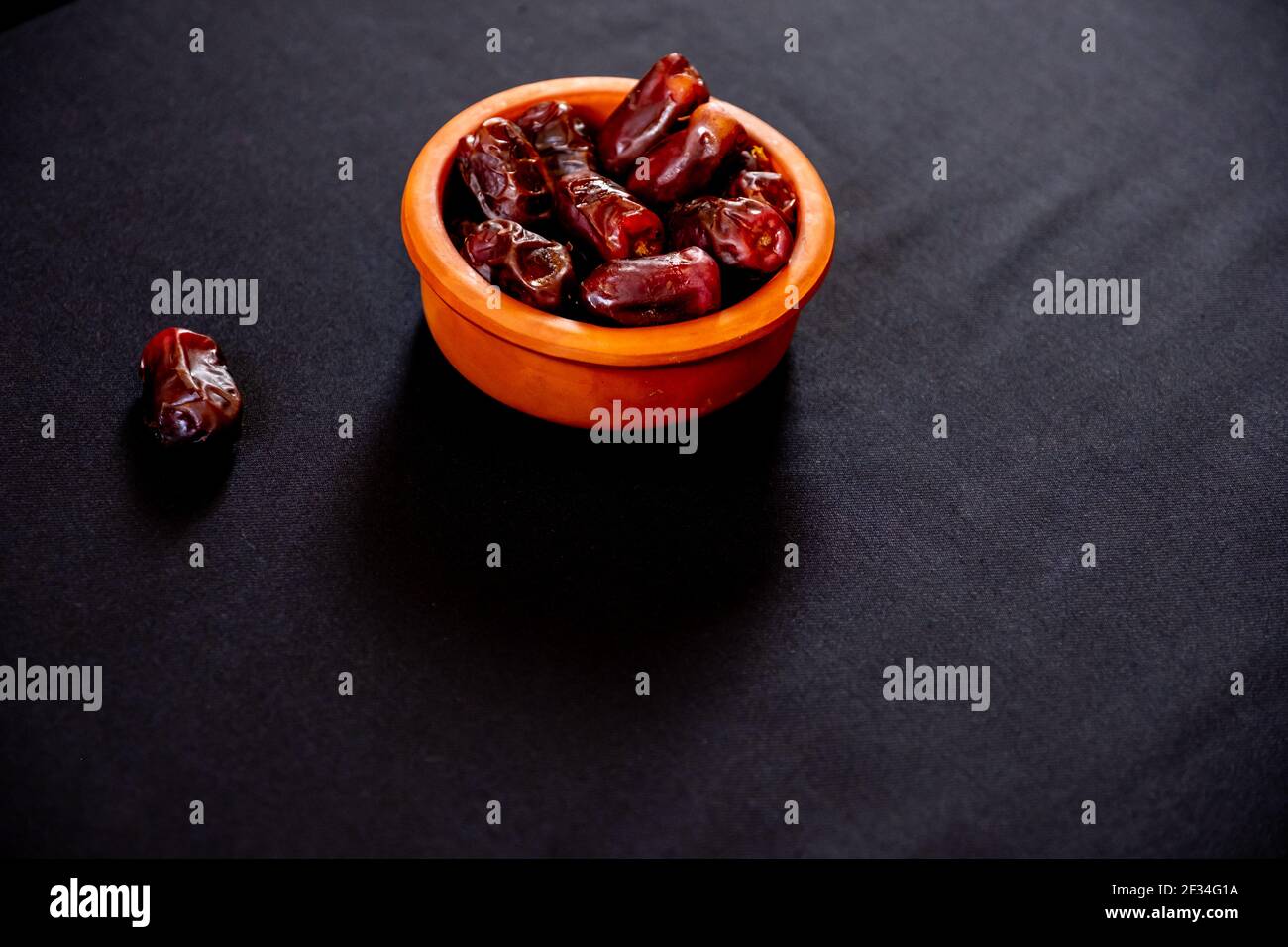 Small pot filled with dates Stock Photo - Alamy