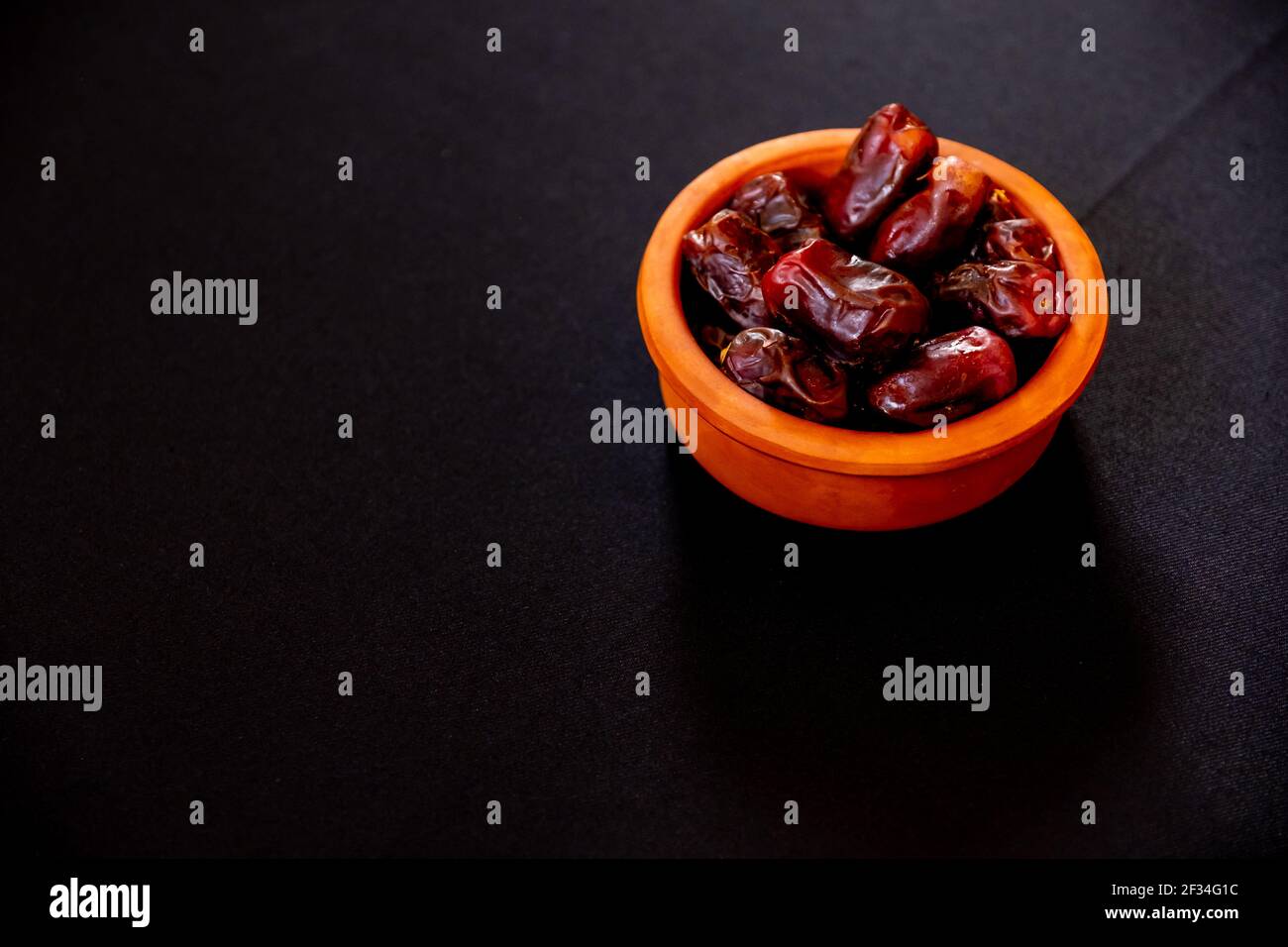 Small pot filled with dates Stock Photo - Alamy