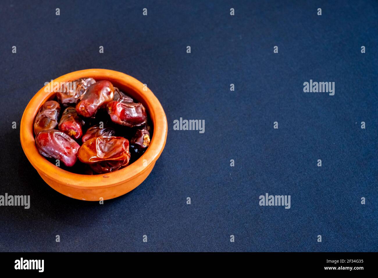 Small pot filled with dates Stock Photo - Alamy