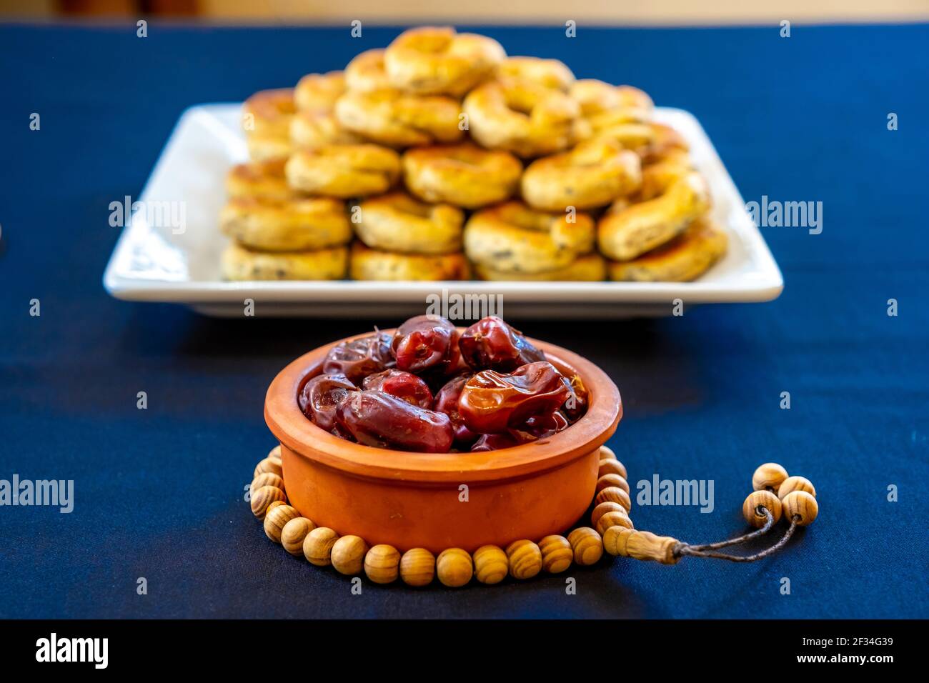 Eid sweets in a white bowl wiht some date Stock Photo - Alamy