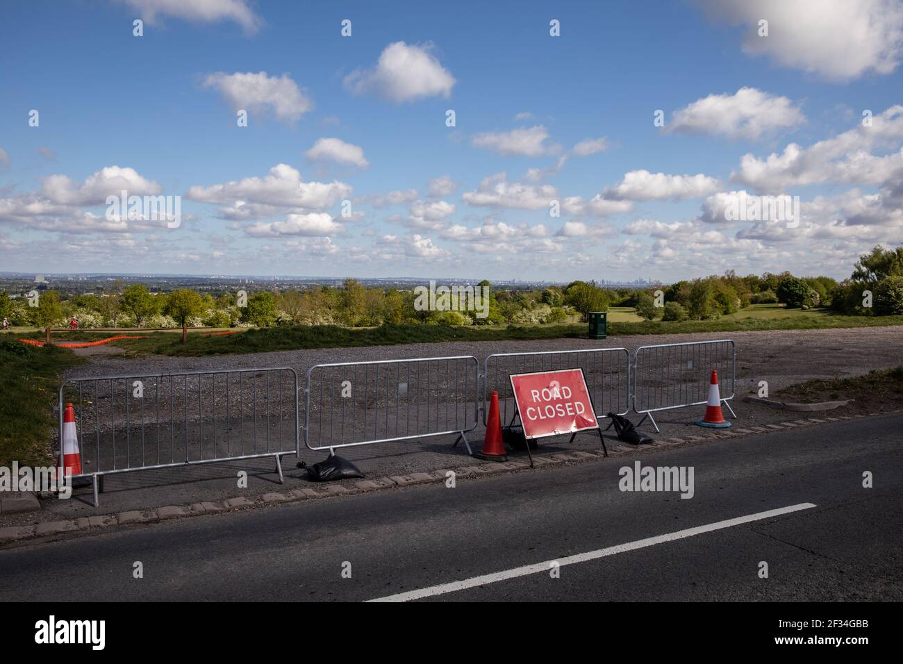 A close car park at Epsom downs looking toward the London skyline ...