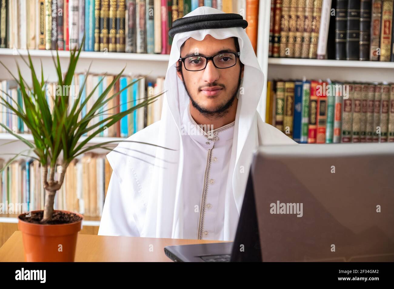 Arabic muslim man doing business online Stock Photo - Alamy
