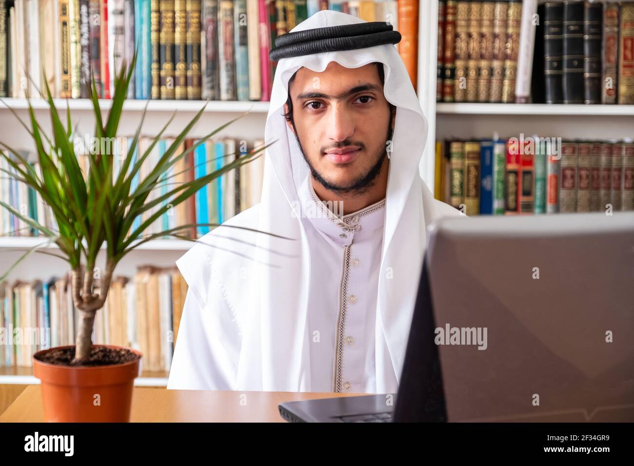 Arabic muslim man doing business online Stock Photo - Alamy