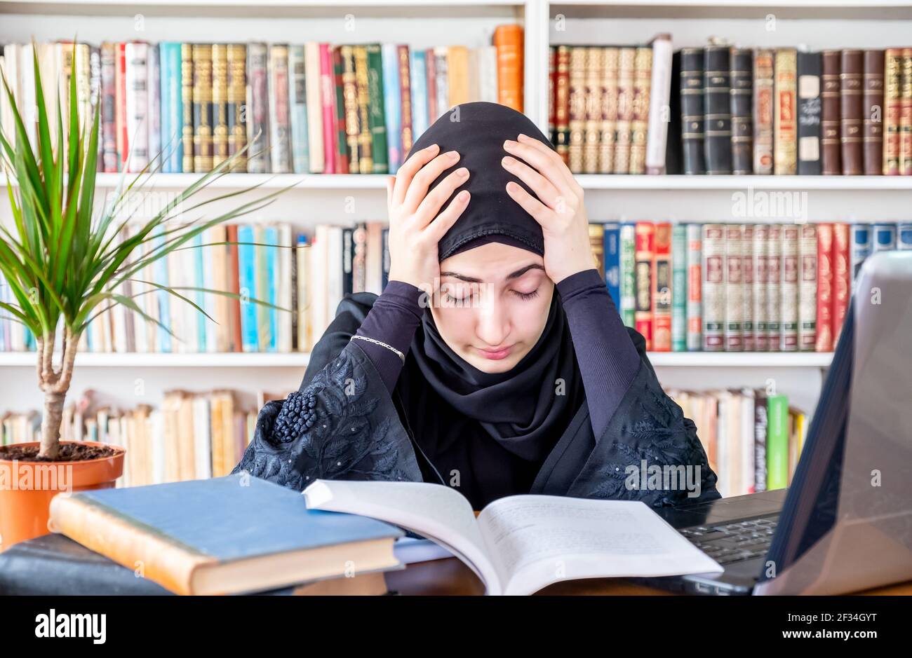 Upset arabic woman sitting home hi-res stock photography and images - Alamy