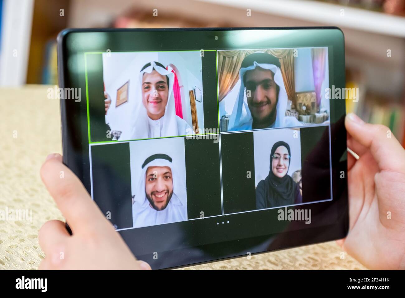 Arabic Muslim people using video conference app online Stock Photo - Alamy