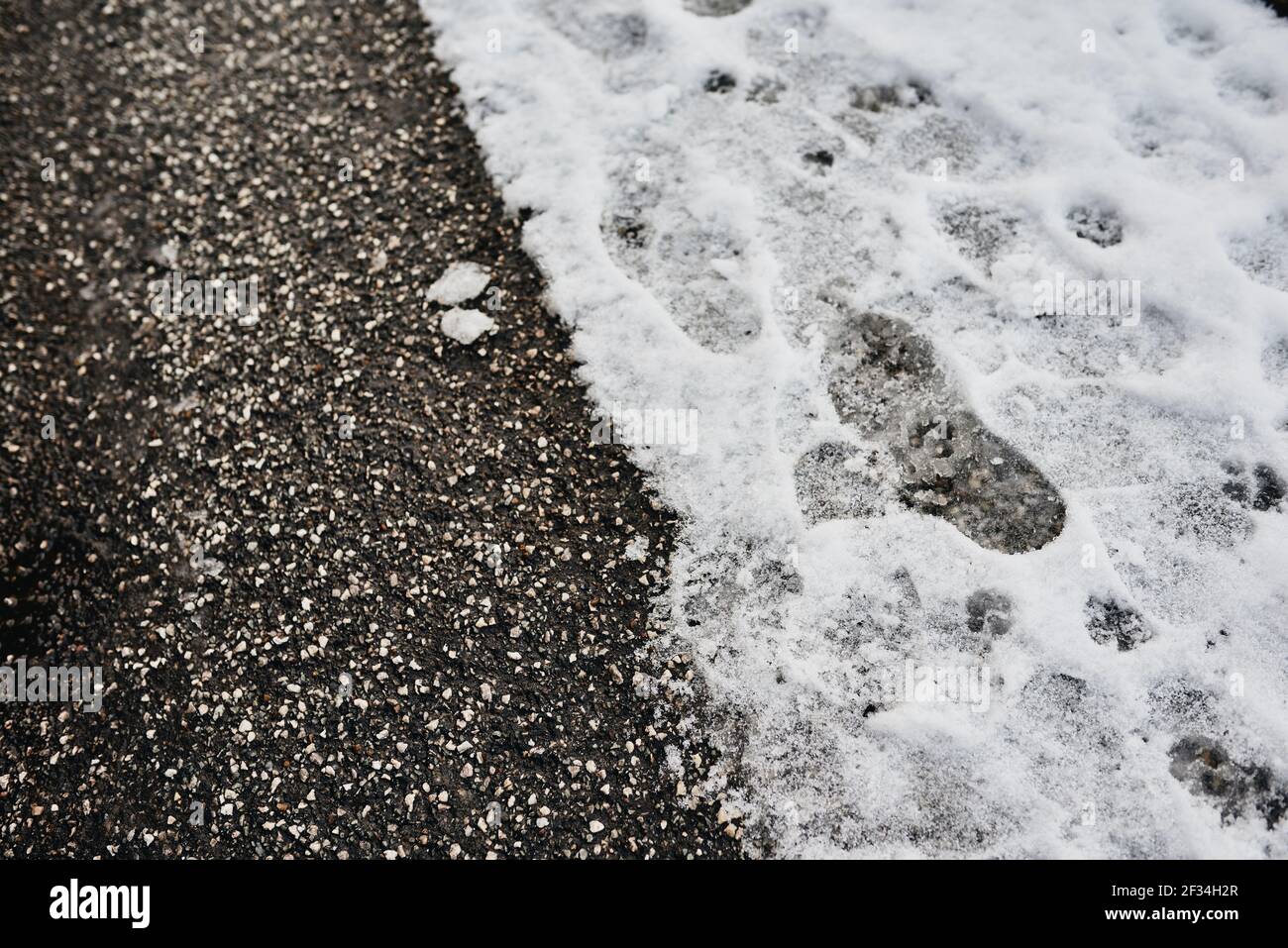 foot step in snow on street Stock Photo - Alamy