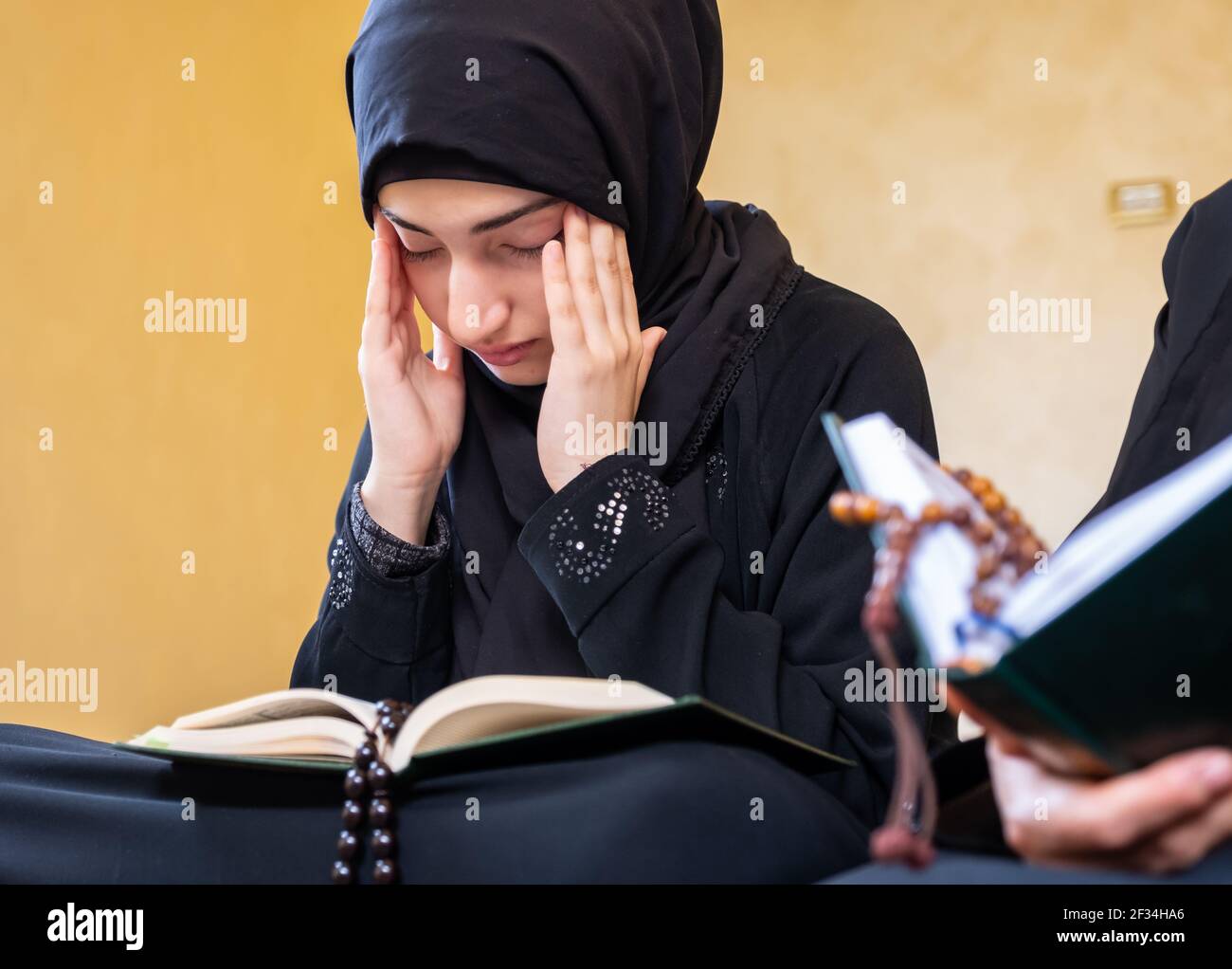Arabic muslim girl reading holy book in ramadan Stock Photo - Alamy