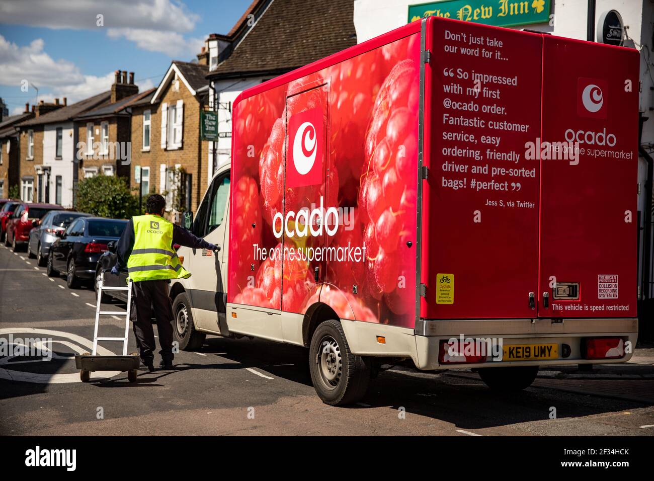 A Ocado delivery driver after dropping off food shopping outside a ...