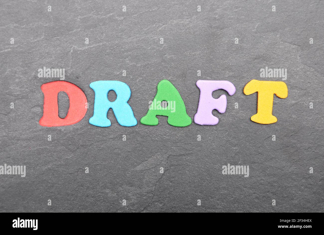 Term from colorful letters on slate board Stock Photo - Alamy