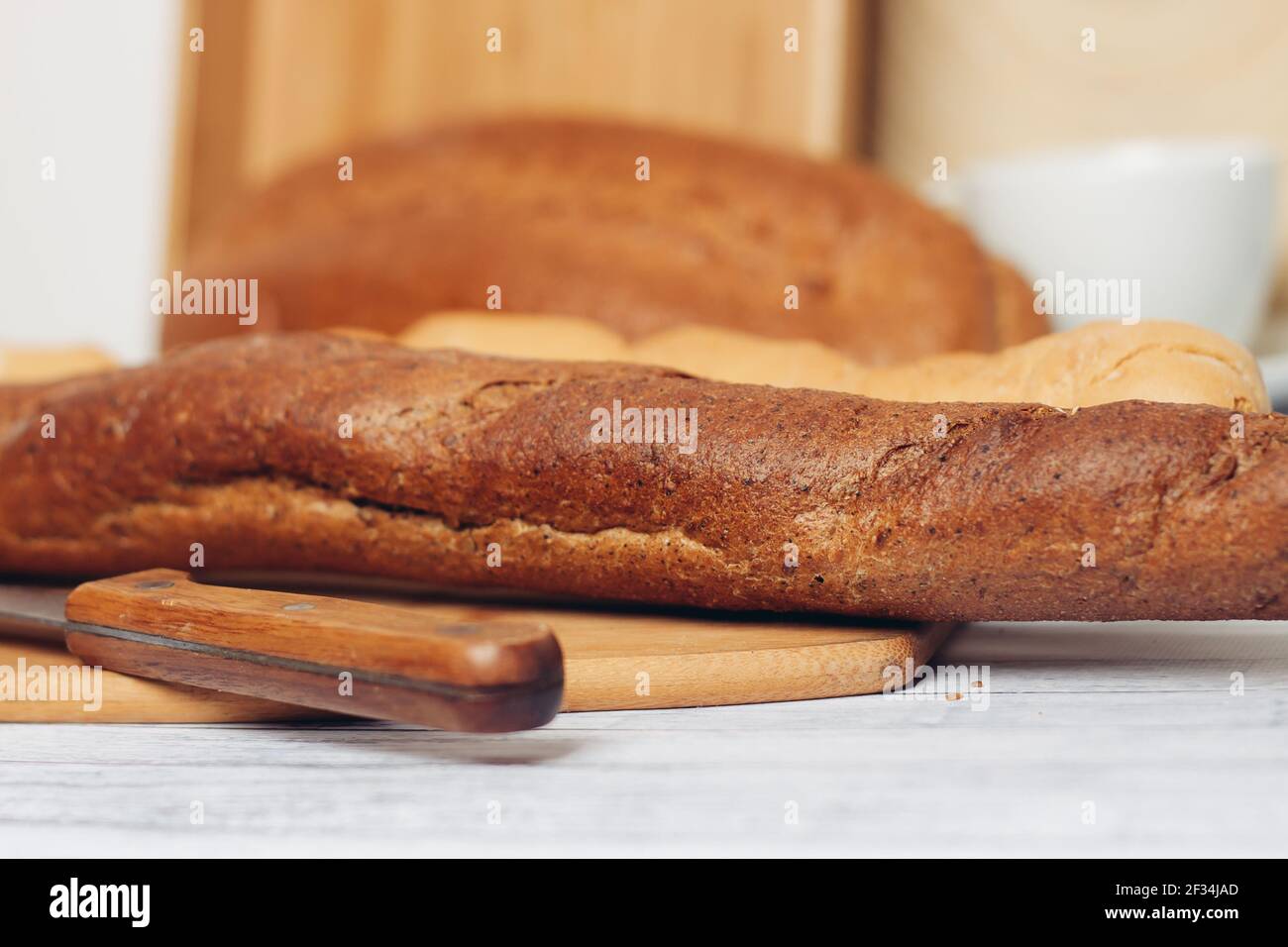different types of loaves cutting board kitchen cutting Stock Photo - Alamy