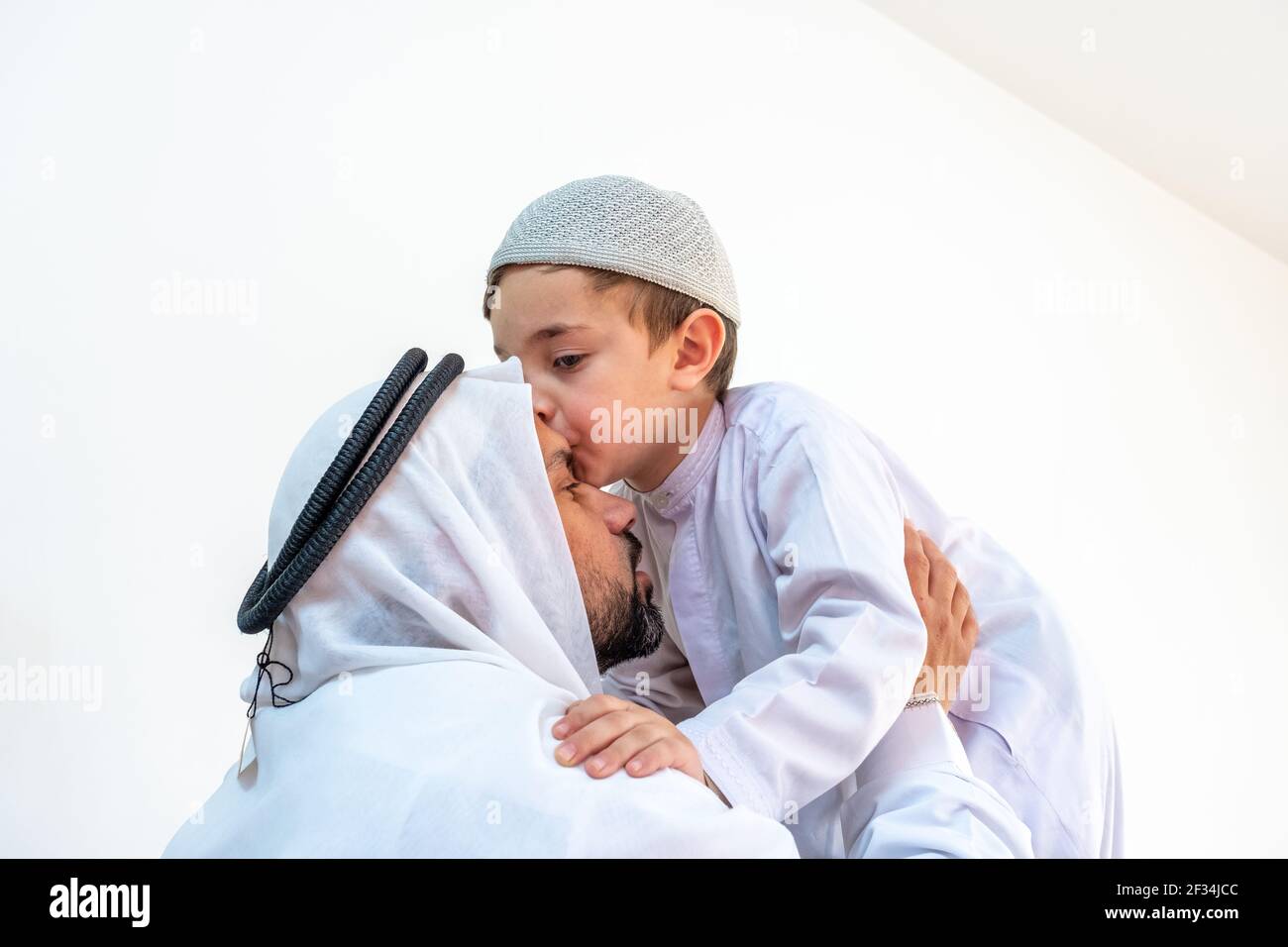 Arabic muslim son kiising his father forehead Stock Photo - Alamy