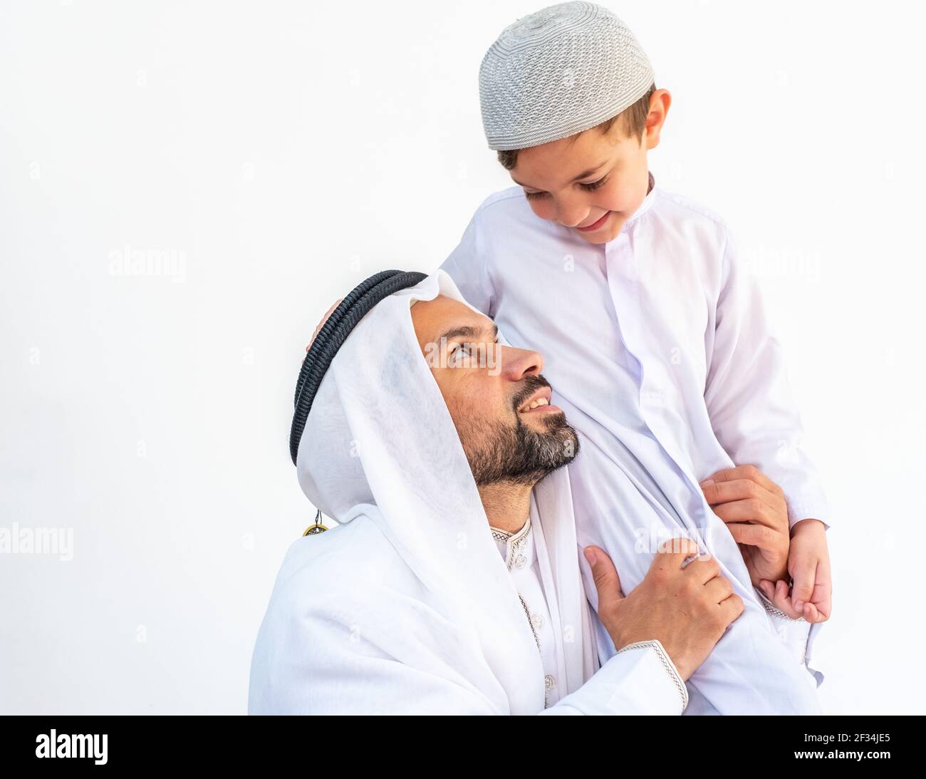 Arabic muslim father holding his son on his shoulder Stock Photo - Alamy
