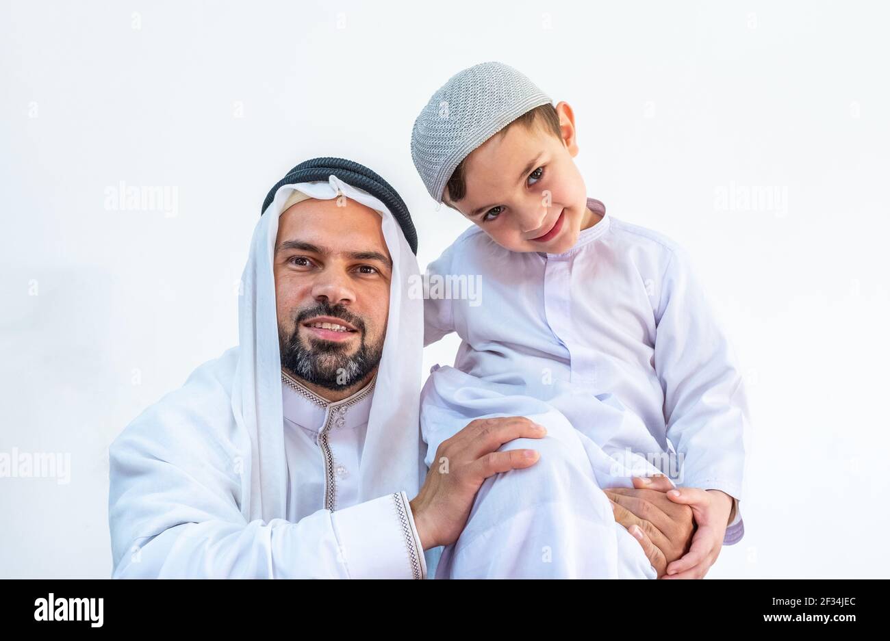 Arabic muslim father holding his son on his shoulder Stock Photo - Alamy