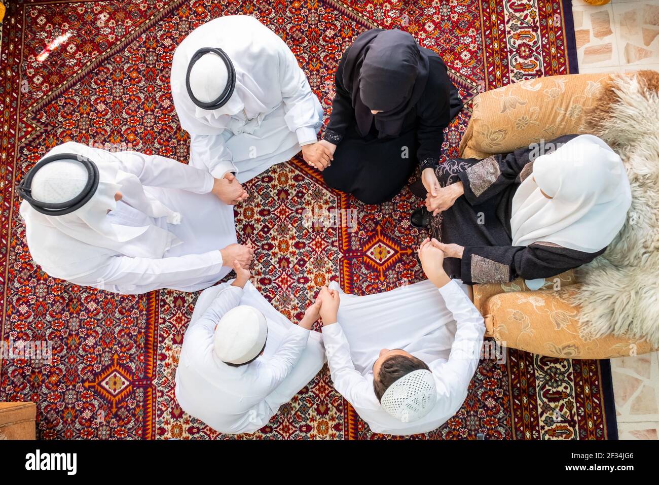 happy Muslim family holding hands together Stock Photo - Alamy
