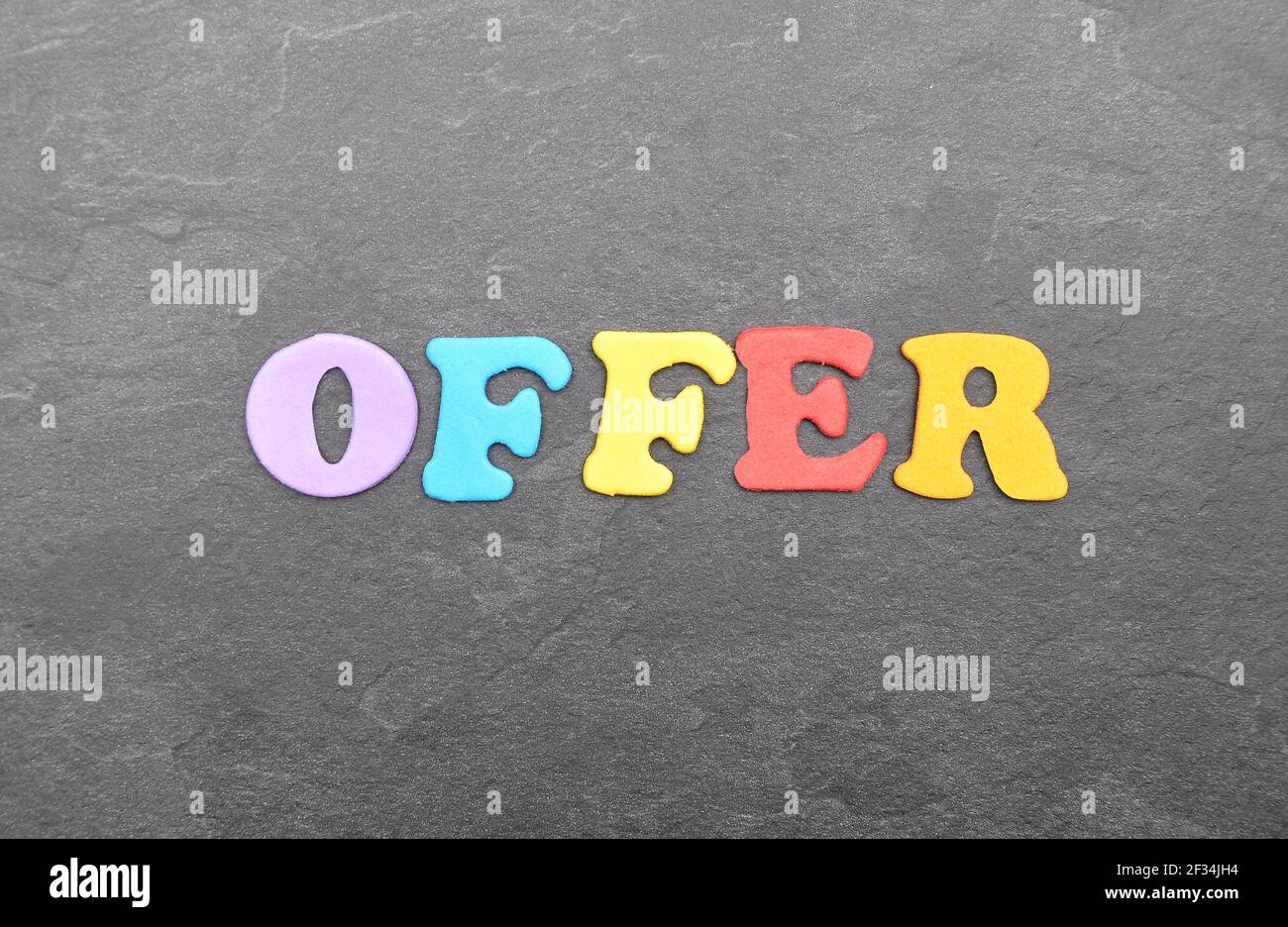 Term from colorful letters on slate board Stock Photo - Alamy