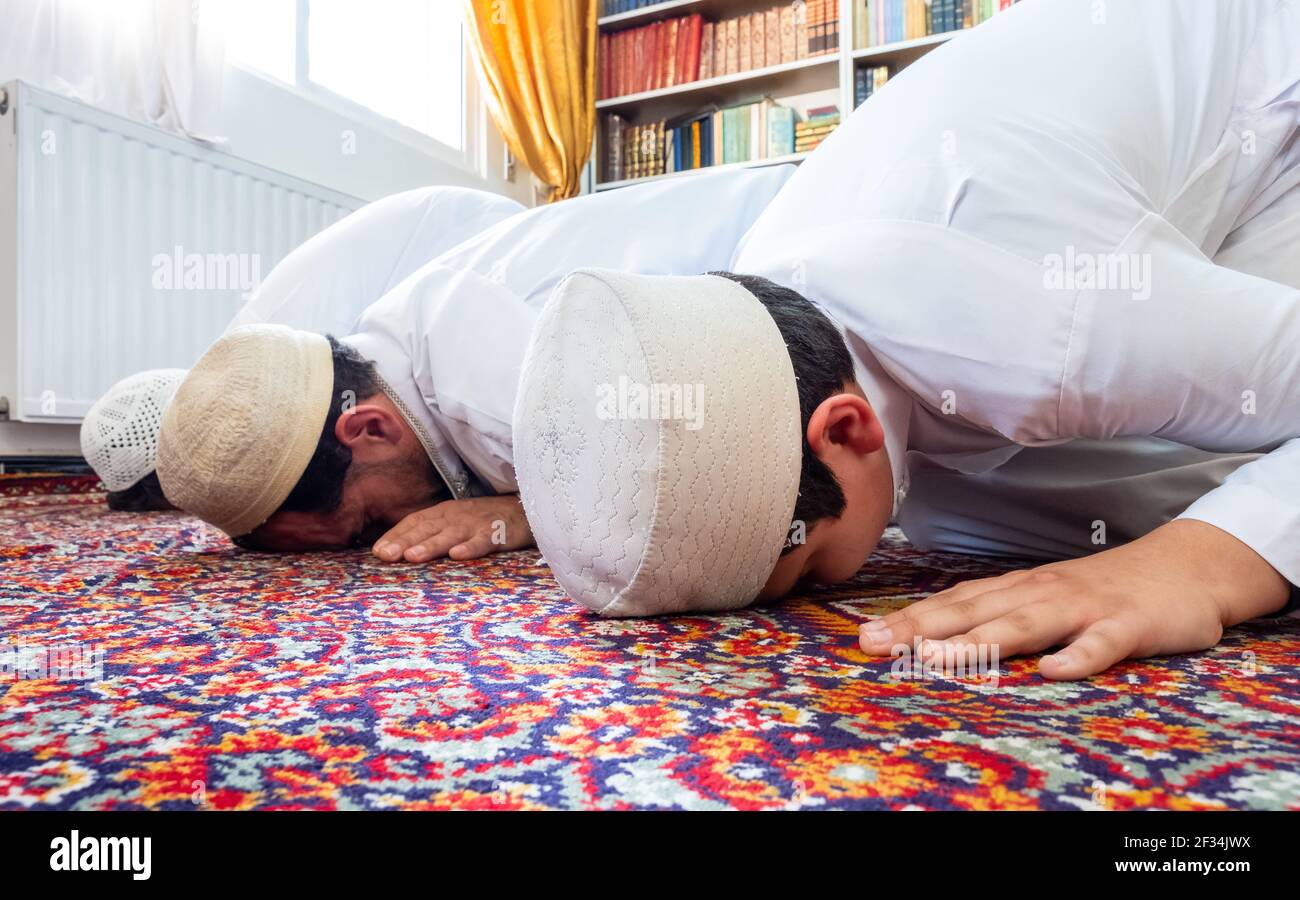 Happy Arabic family praying together Stock Photo - Alamy