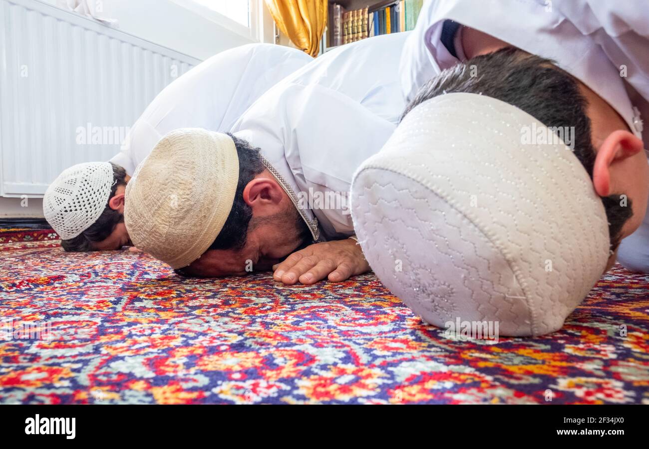 Happy Arabic family praying together Stock Photo - Alamy