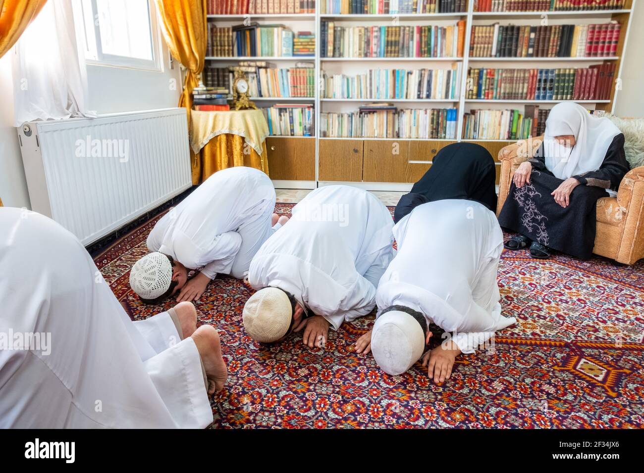 Happy Arabic family praying together Stock Photo - Alamy