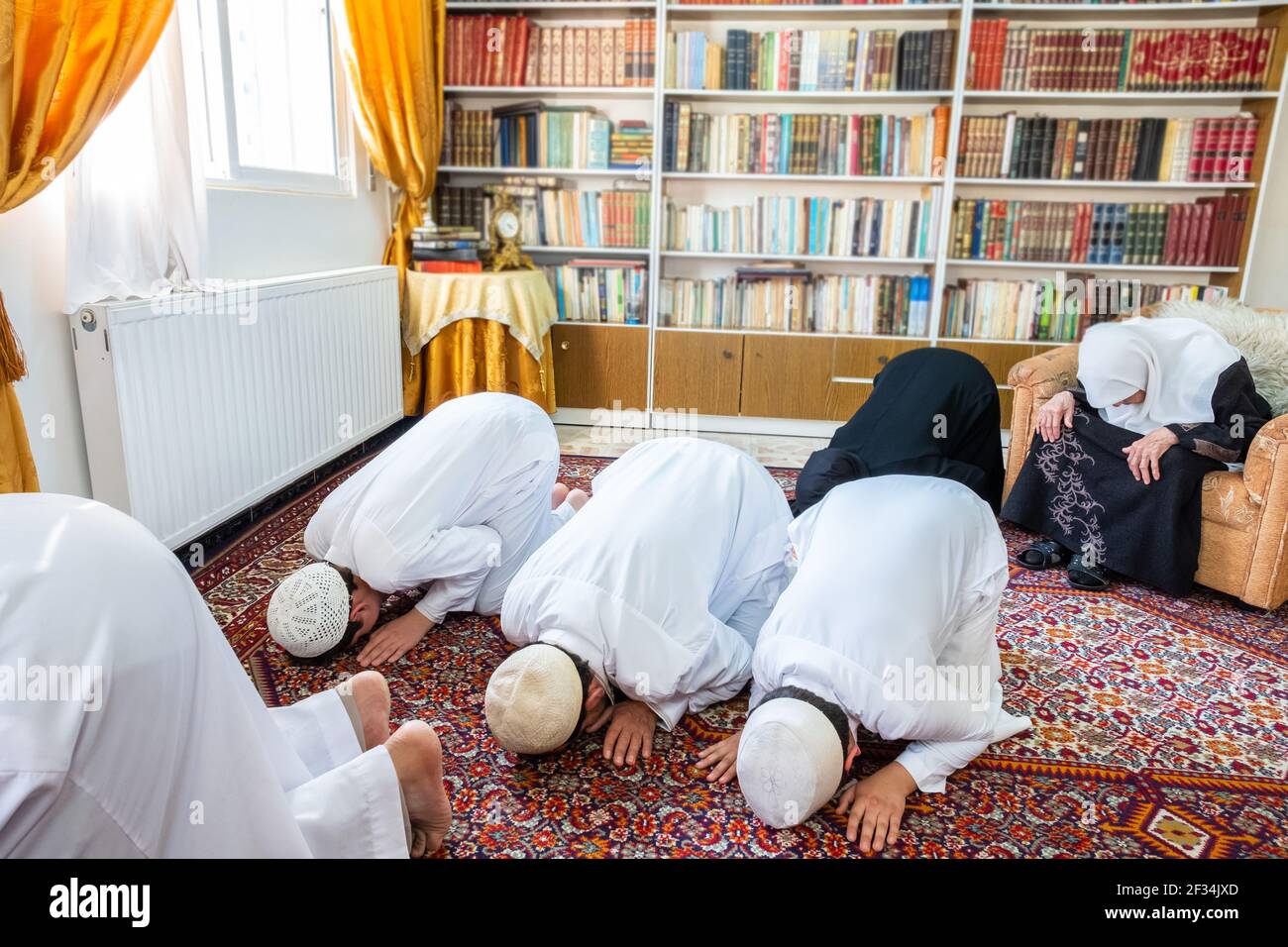 Happy Arabic family praying together Stock Photo - Alamy