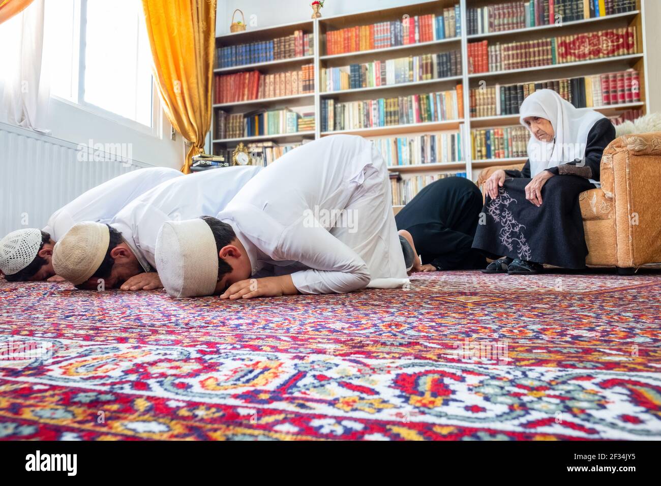 Happy Arabic family praying together Stock Photo - Alamy