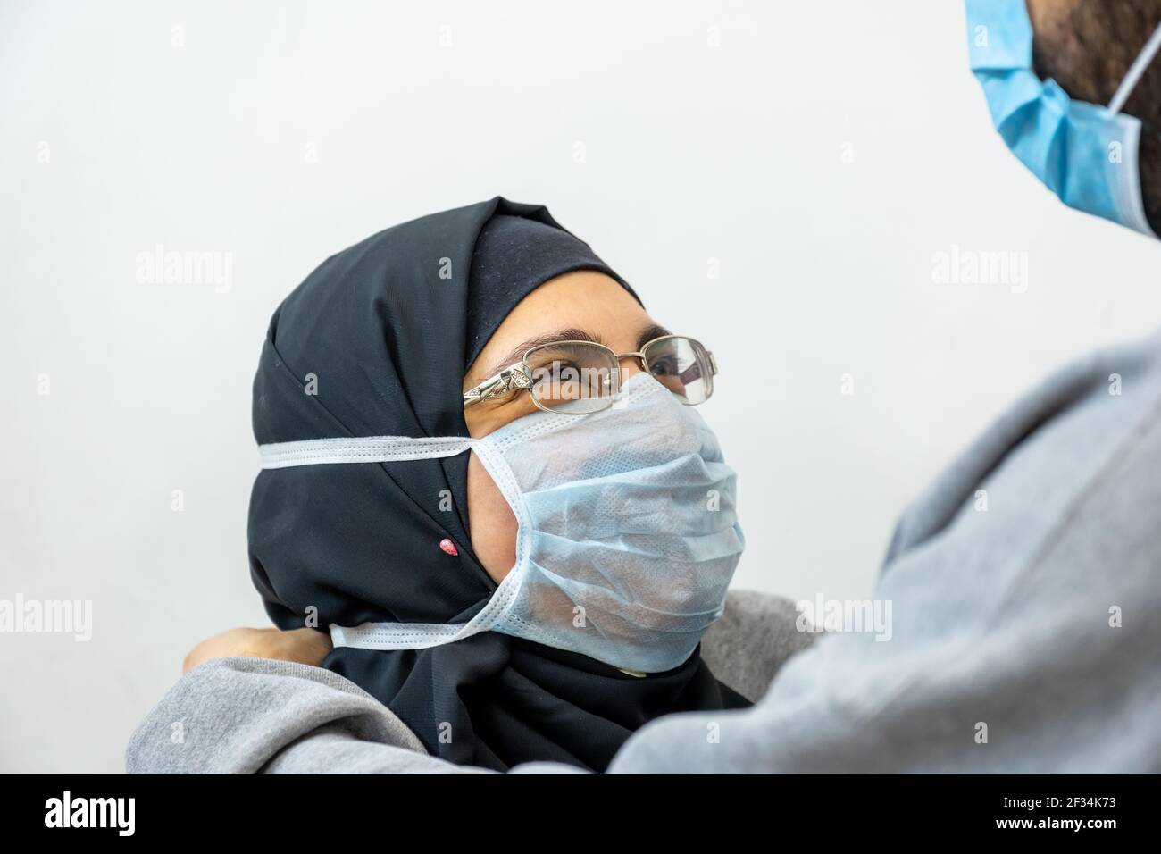 Arabic Muslim male and female wearing masks Stock Photo - Alamy
