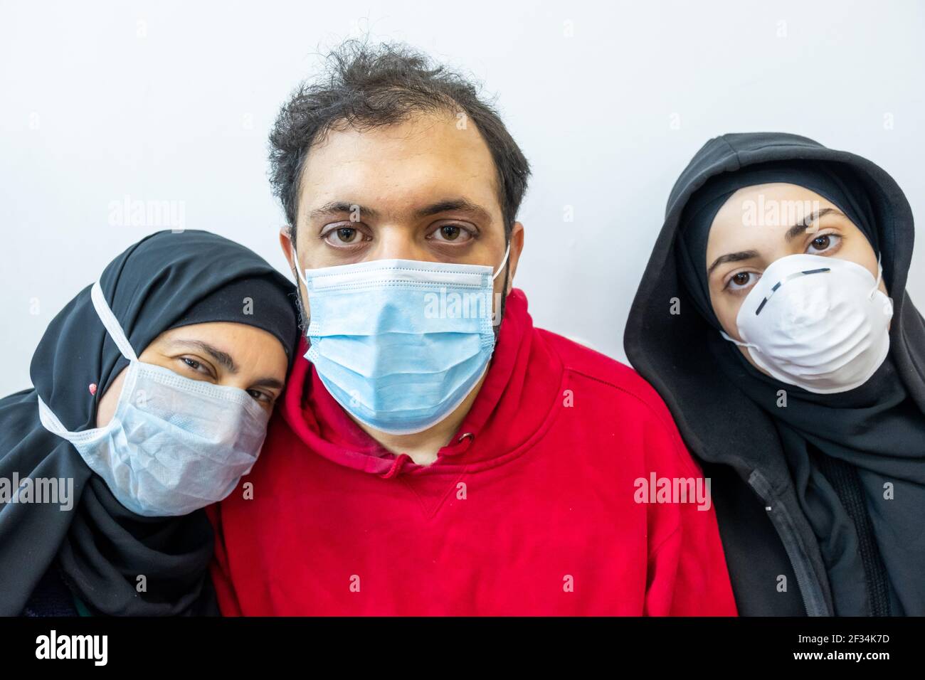 Arabic Muslim male and female wearing masks Stock Photo - Alamy