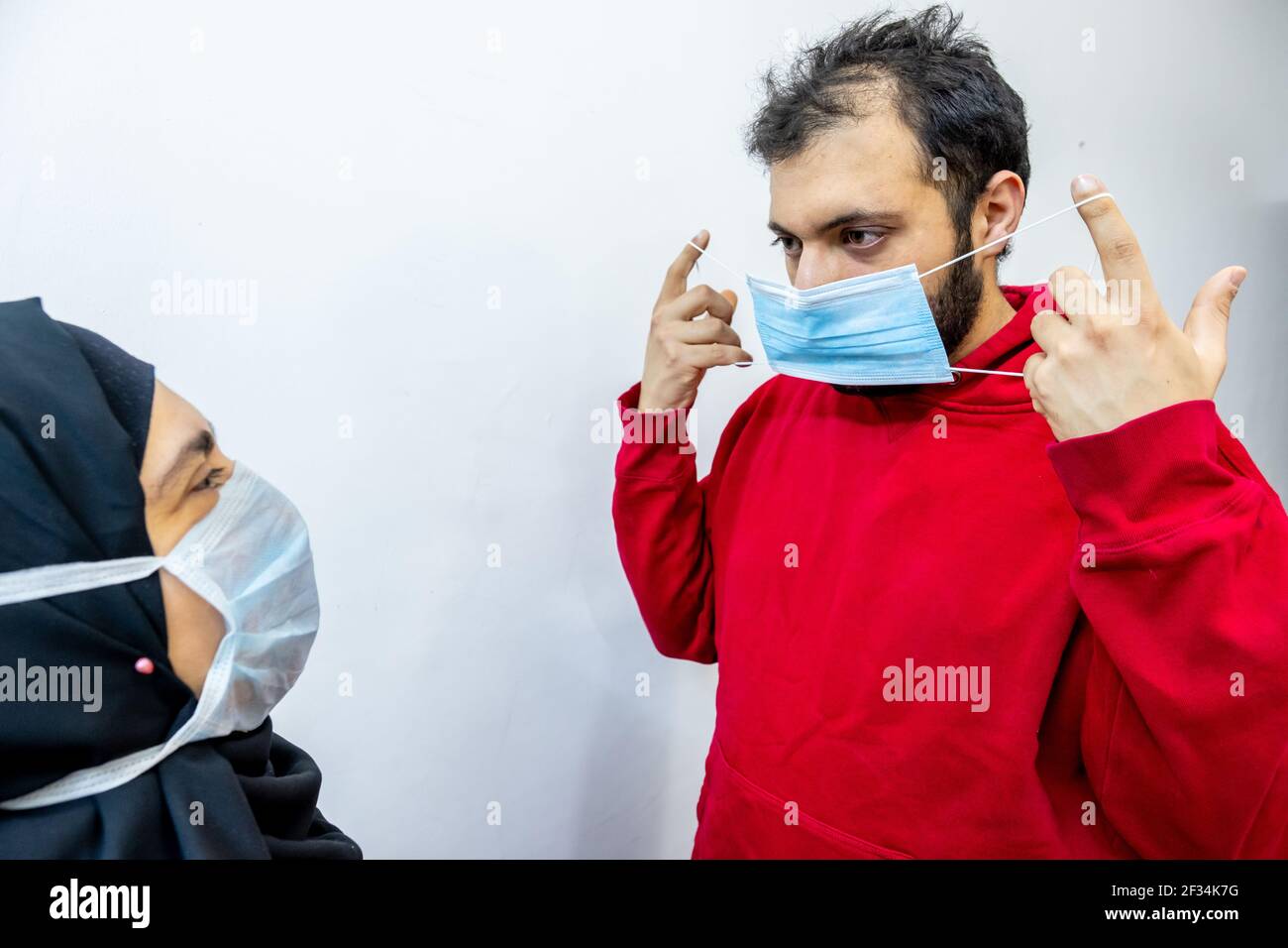 Arabic Muslim male and female wearing masks Stock Photo - Alamy