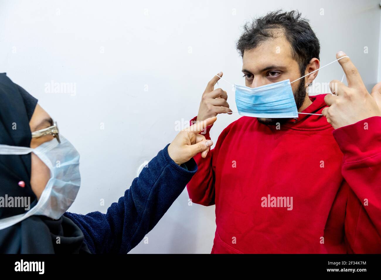 Arabic Muslim male and female wearing masks Stock Photo - Alamy