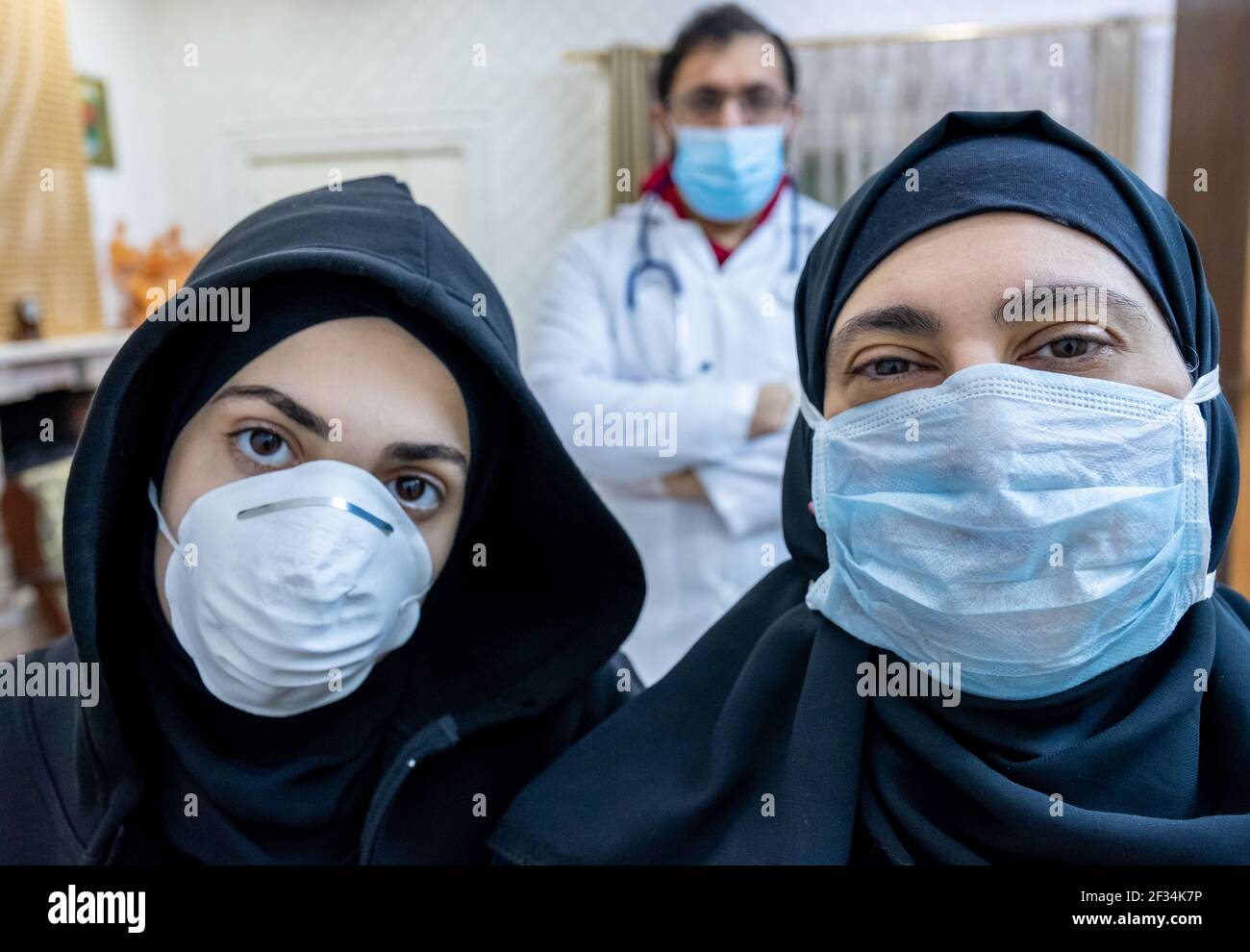 Arabic Muslim family wearing masks Stock Photo - Alamy