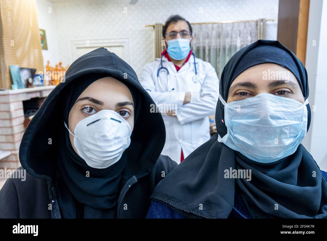 Arabic Muslim family wearing masks Stock Photo - Alamy