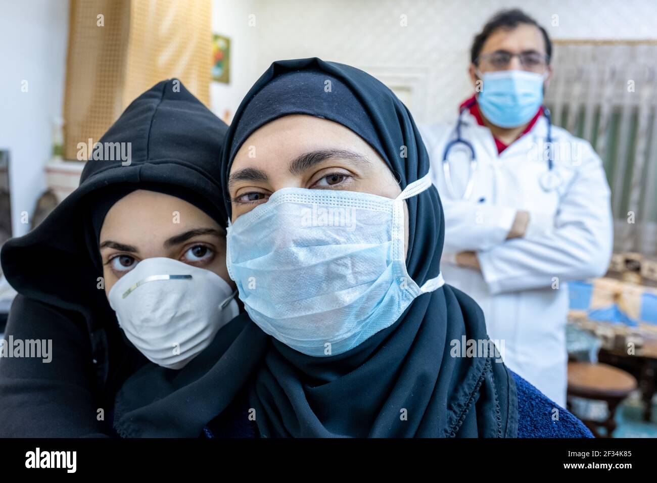 Arabic Muslim family wearing masks Stock Photo - Alamy