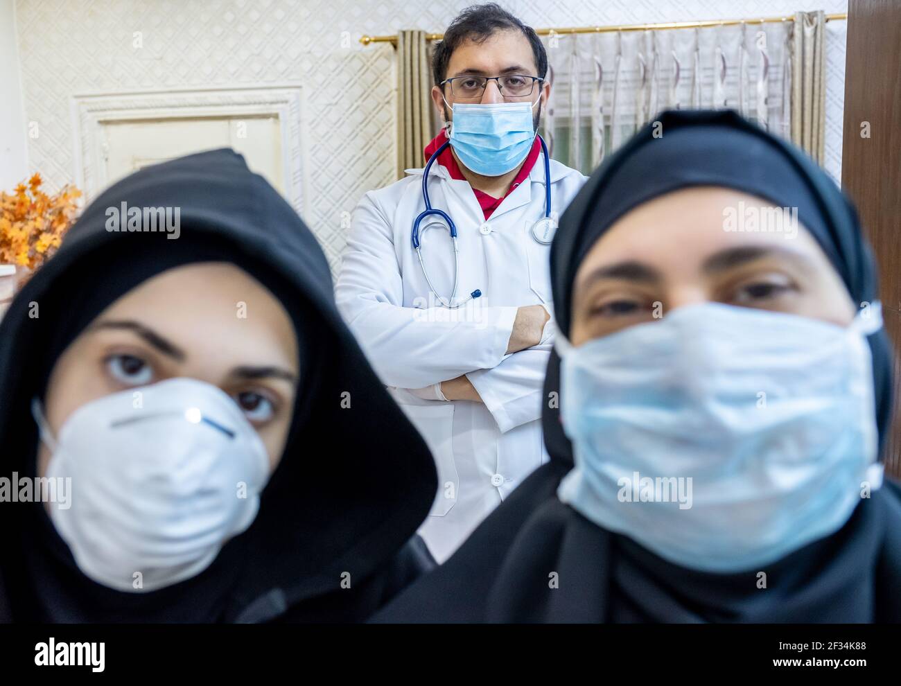 Arabic Muslim family wearing masks Stock Photo - Alamy