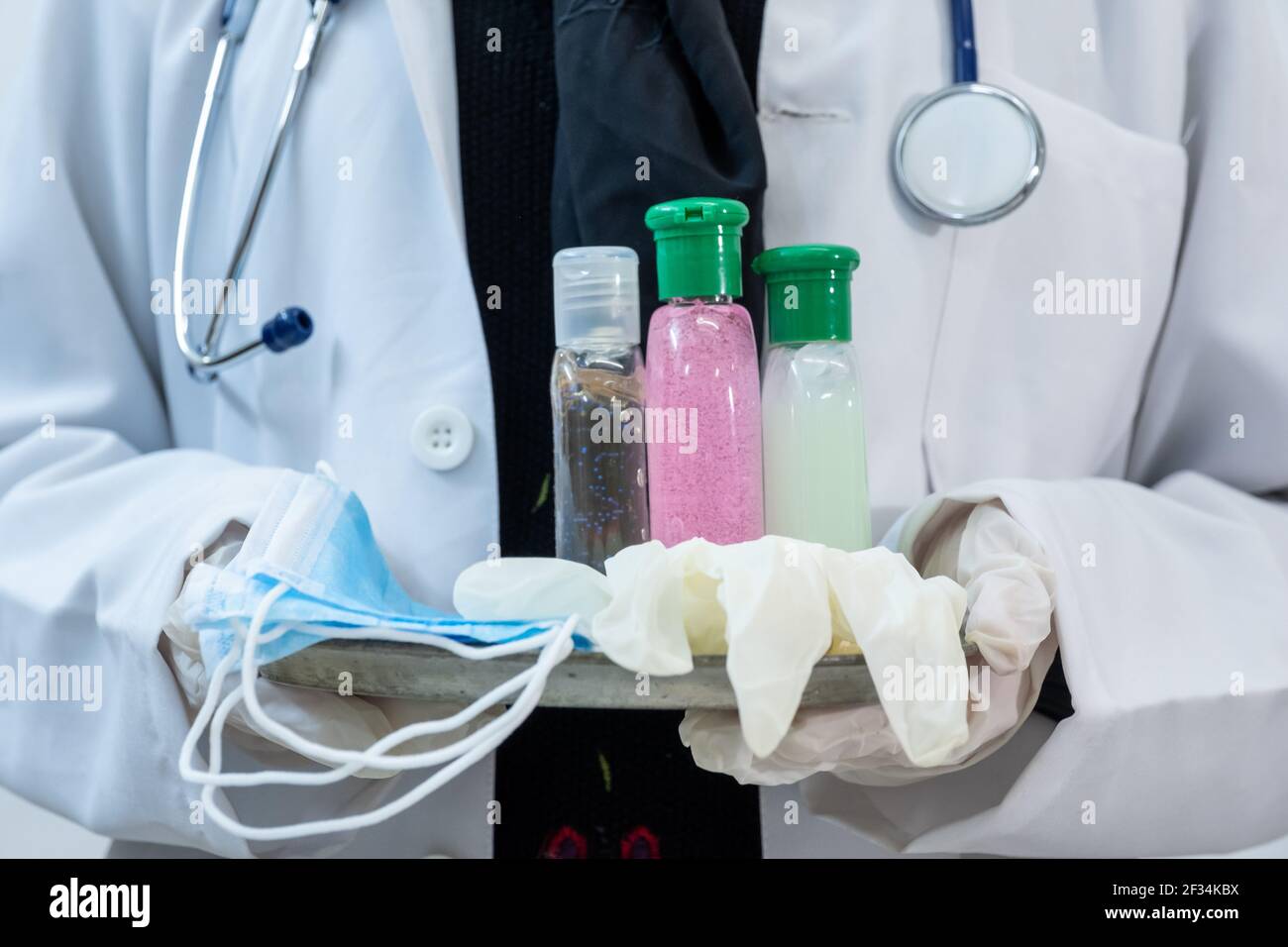Arabic Muslim doctor wearing a mask and presenting hygiene and ...