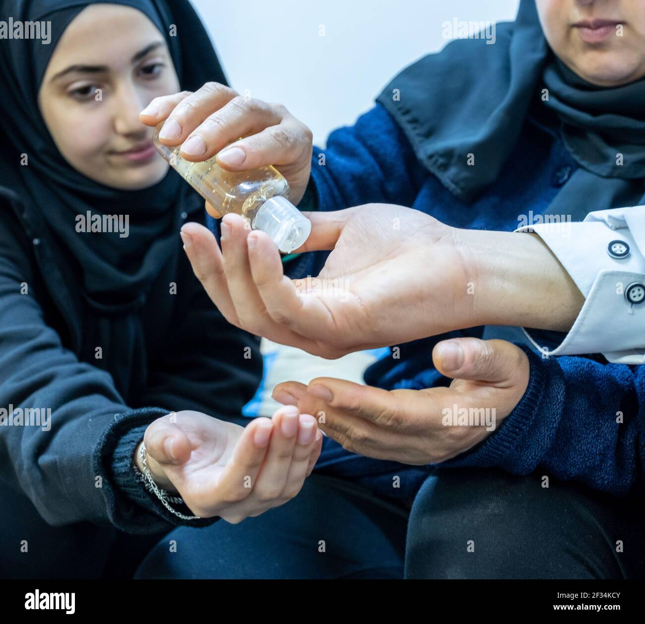 Arabic Muslim family using hygiene products Stock Photo - Alamy