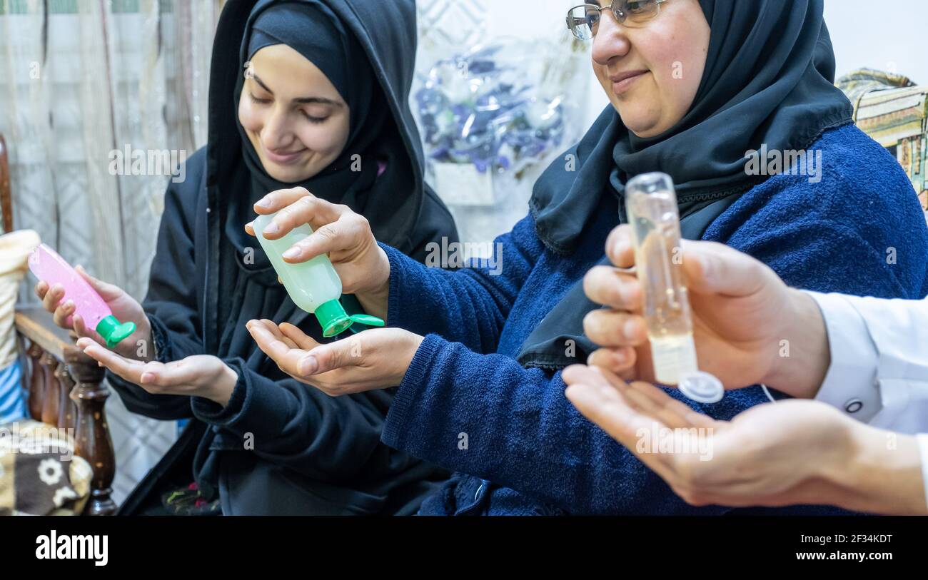 Arabic Muslim family using hygiene products Stock Photo - Alamy