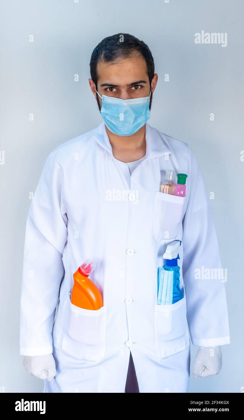 Arabic Muslim, a doctor holding many hygiene products Stock Photo - Alamy