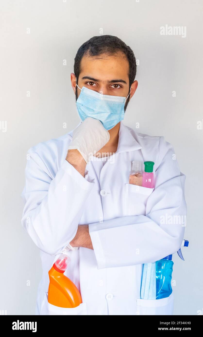 Arabic Muslim, a doctor holding many hygiene products Stock Photo - Alamy